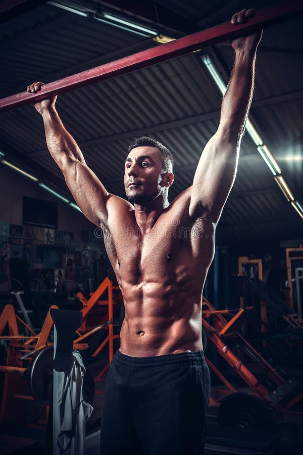 Muscle man who is posing stock photo. Image of body, attractive - 45782416