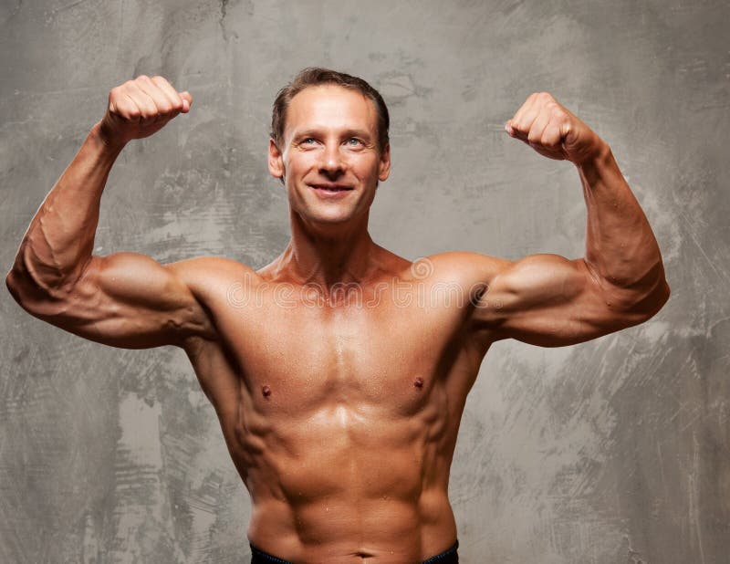 Muscle Sportsman on a Grey Background Stock Photo - Image of human ...