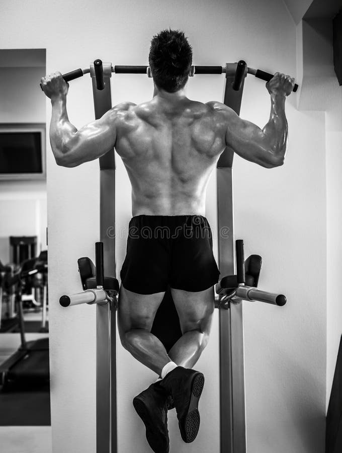 Bodybuilder Pulling Up on a Bar in a Gym Stock Photo - Image of healthy ...