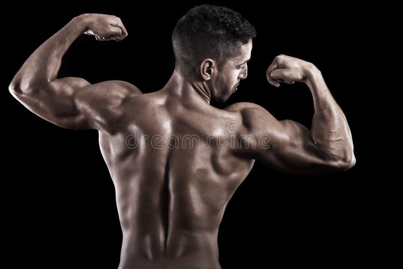 Muscular Man Flexing Back Muscles Pose Stock Photo - Image of build ...