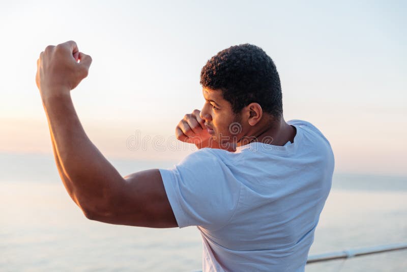 Muscular African Man Athlete Standing and Practicing Shadow Boxing ...