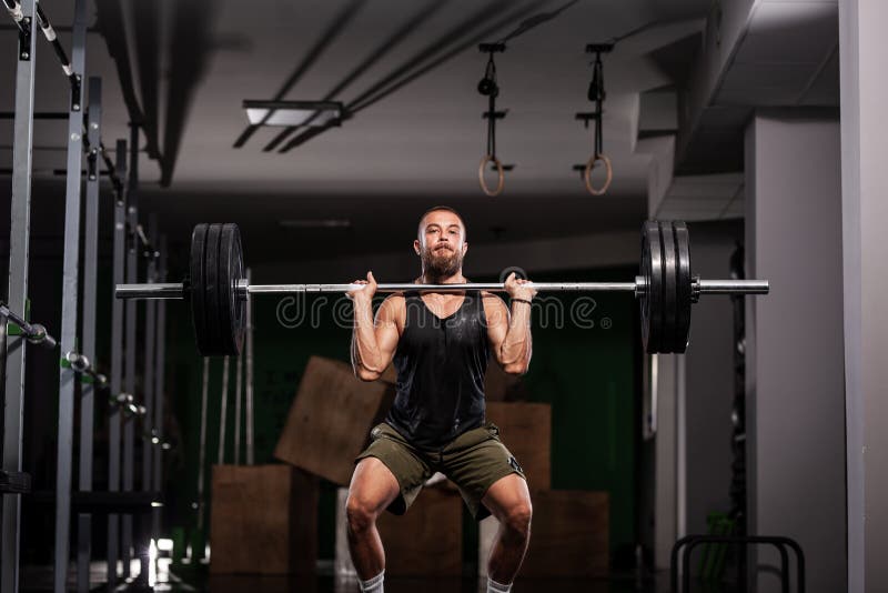Muscular Athlete Lifting Very Heavy Barbell Stock Photo - Image of ...