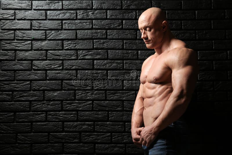 Muscular Bodybuilder on Dark Background Stock Photo - Image of muscles ...
