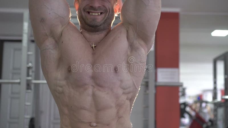 Muscular Bodybuilder in Gym Posing on the Camera. Slowly Stock Video ...