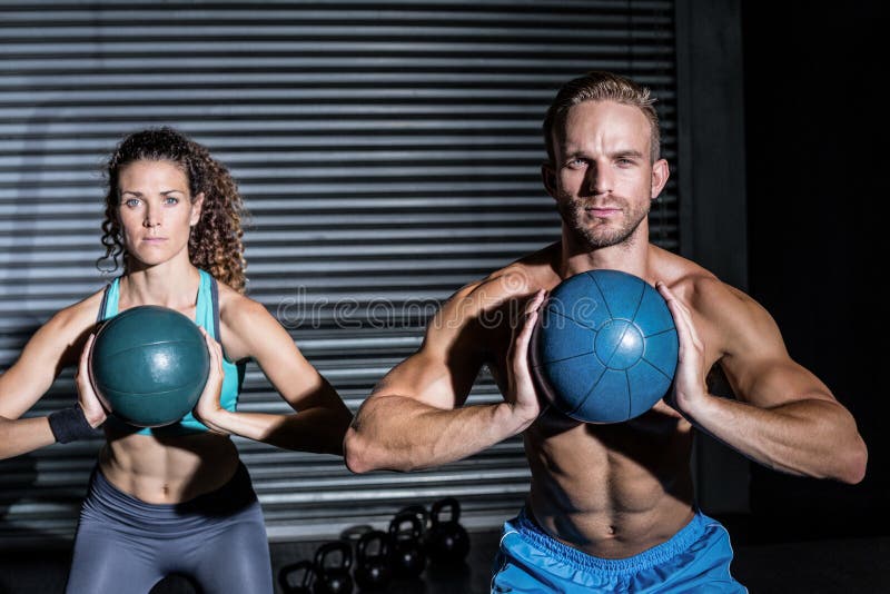 Muscular Couple Doing Ball Exercise Stock Image - Image of female ...