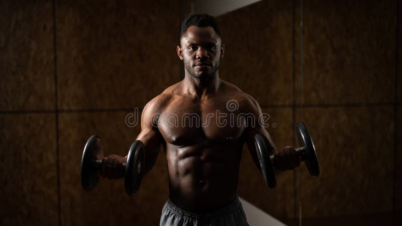 Muscular Dark-skinned Man Doing an Exercise with Dumbbells. Stock Image ...