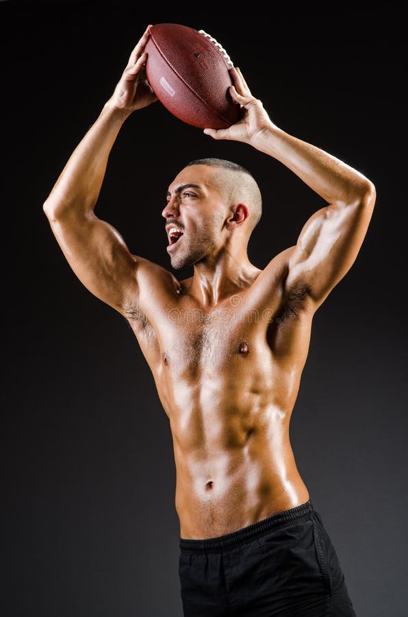 Muscular football player stock image. Image of leisure - 51092351