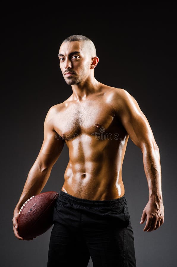 Muscular Football Player with Ball Stock Image - Image of black ...