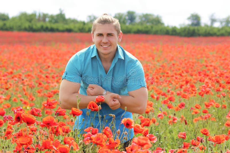 A Muscular Guy on the Poppy Field Stock Image - Image of flowers ...