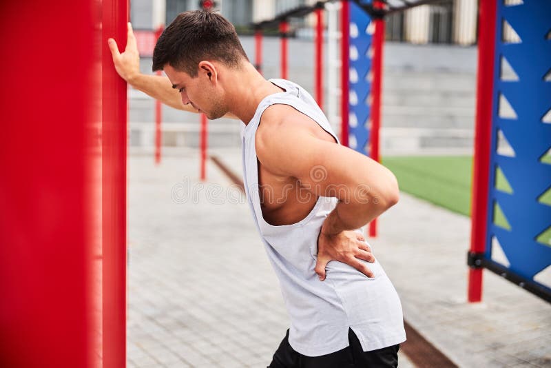 Athletic Young Man Exhausted after Training on Sports Ground Stock ...
