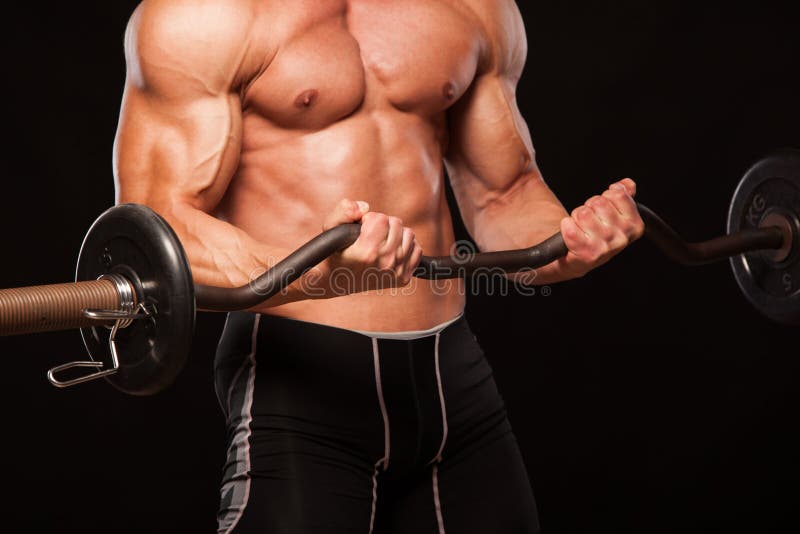 Muscular Male Athlete is Training by Lifting the Barbell Stock Photo ...