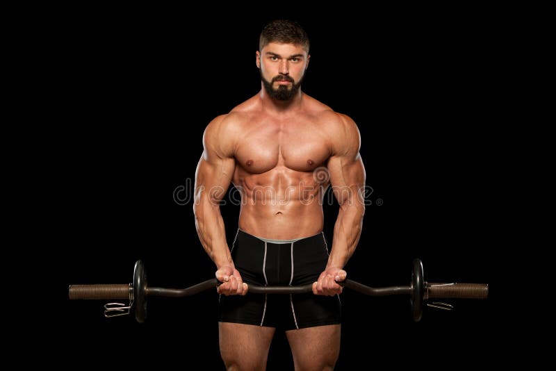 Muscular Male Athlete is Training by Lifting the Barbell Stock Photo ...