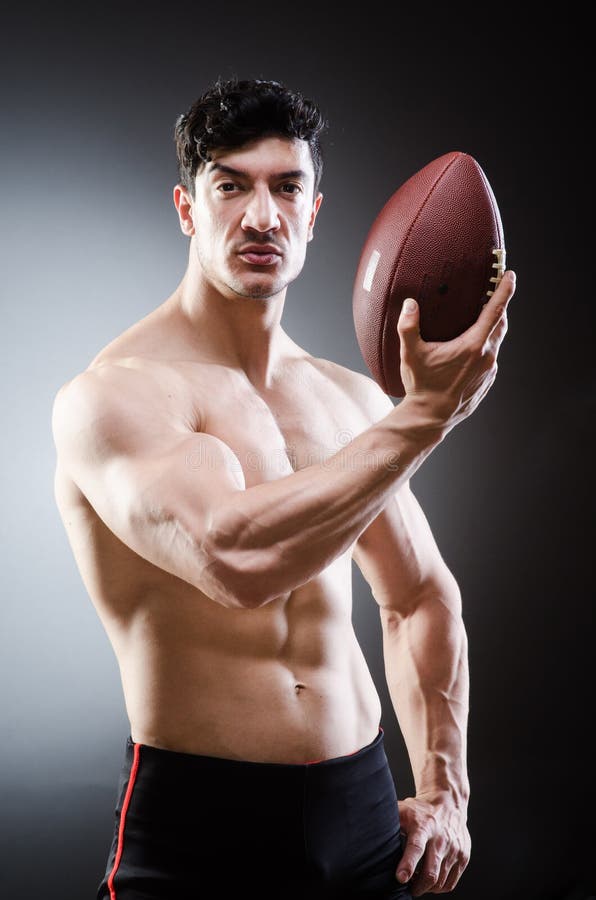 The Muscular Man with American Football Stock Photo - Image of ...
