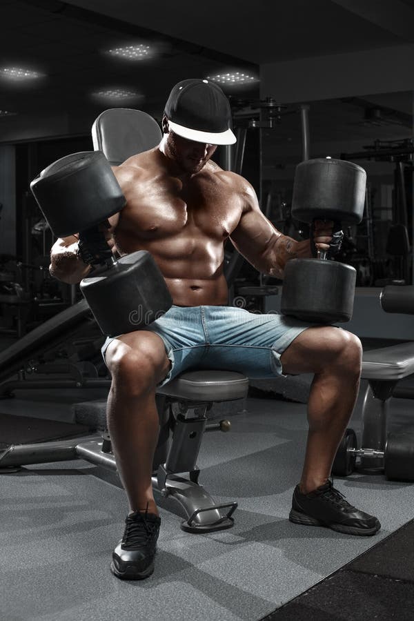 Muscular Man with Big Dumbbells Working Out in Gym, Doing Exercise ...