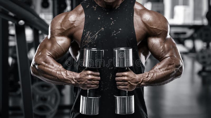 Muscular Man Bodybuilder Working Out in Gym. Strong Man Doing Exercise ...