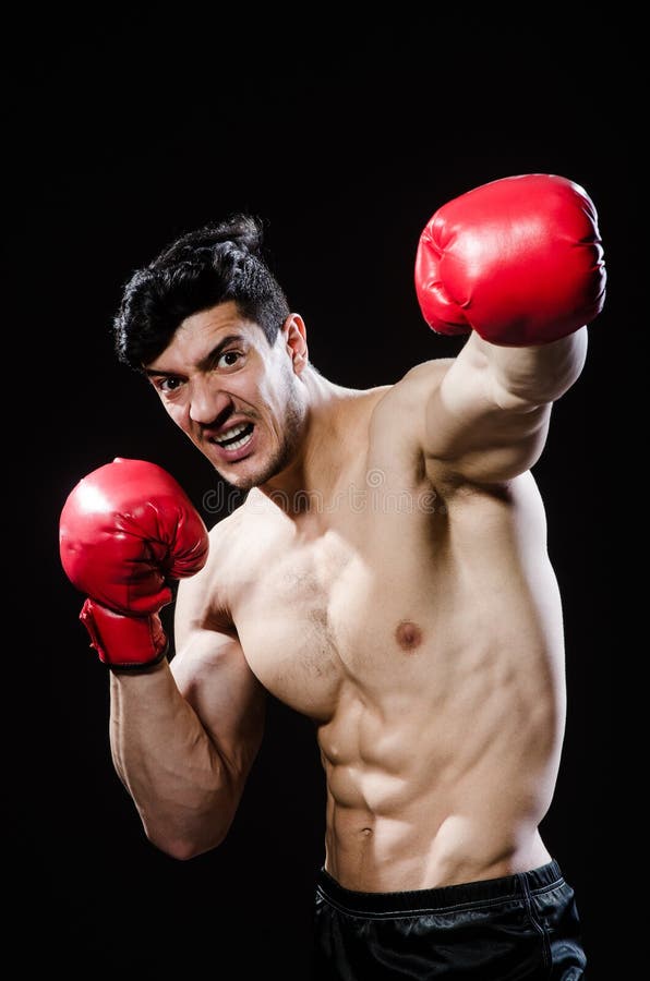 The Muscular Man in Boxing Concept Stock Photo - Image of gloves, hand ...