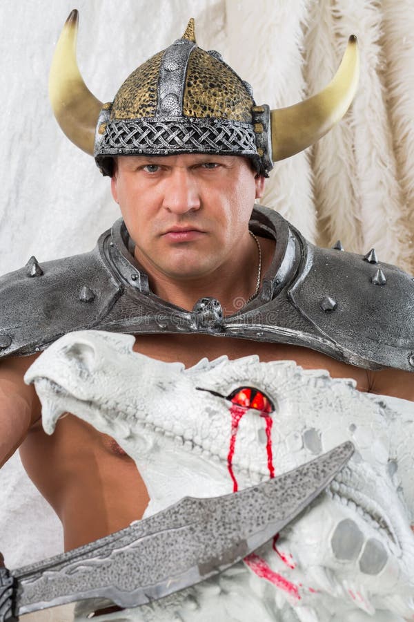 A Muscular Man in Costume Viking with a Sword and Stock Image - Image ...