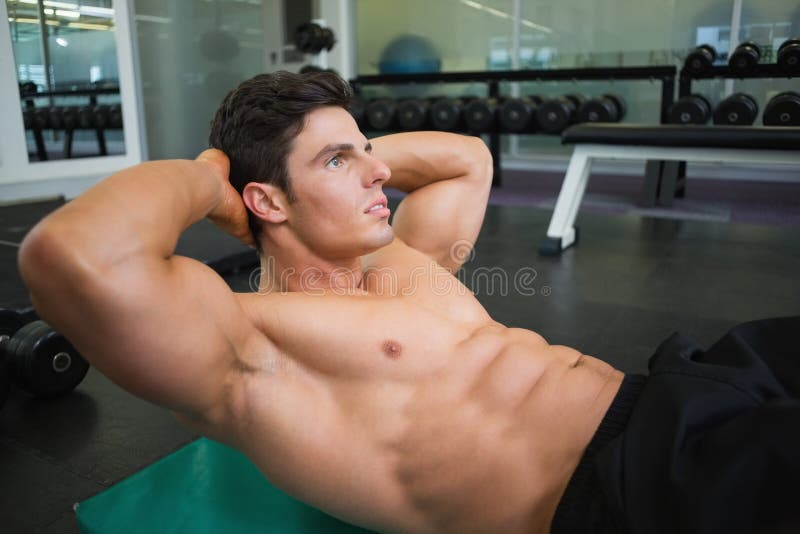 Muscular Man Doing Abdominal Crunches in Gym Stock Image - Image of ...