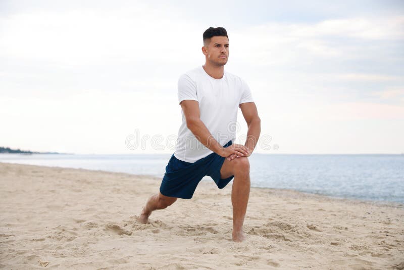 Muscular Man Doing Exercise on Beach. Body Training Stock Image - Image ...