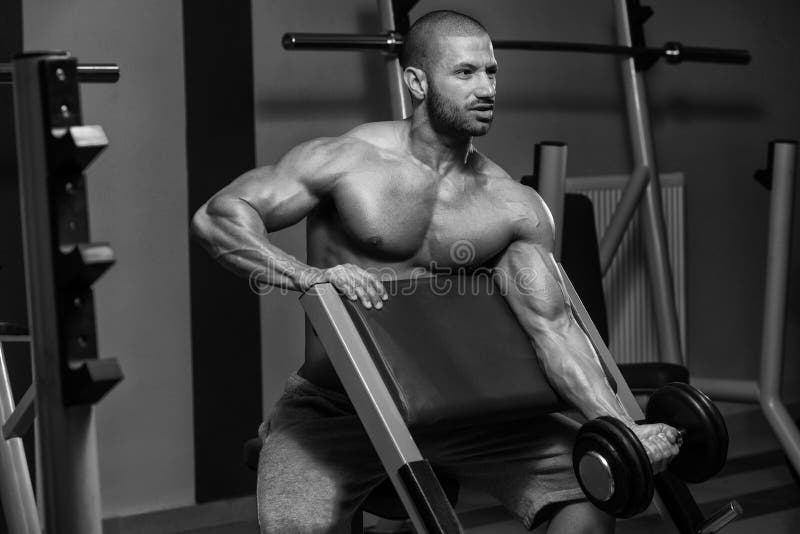 Muscular Man Doing Heavy Weight Exercise for Biceps Stock Image - Image ...