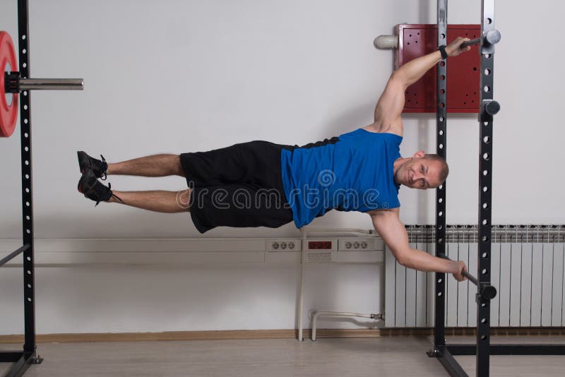 Muscular Man Doing Human Flag Exercise Stock Photo - Image of caucasian ...