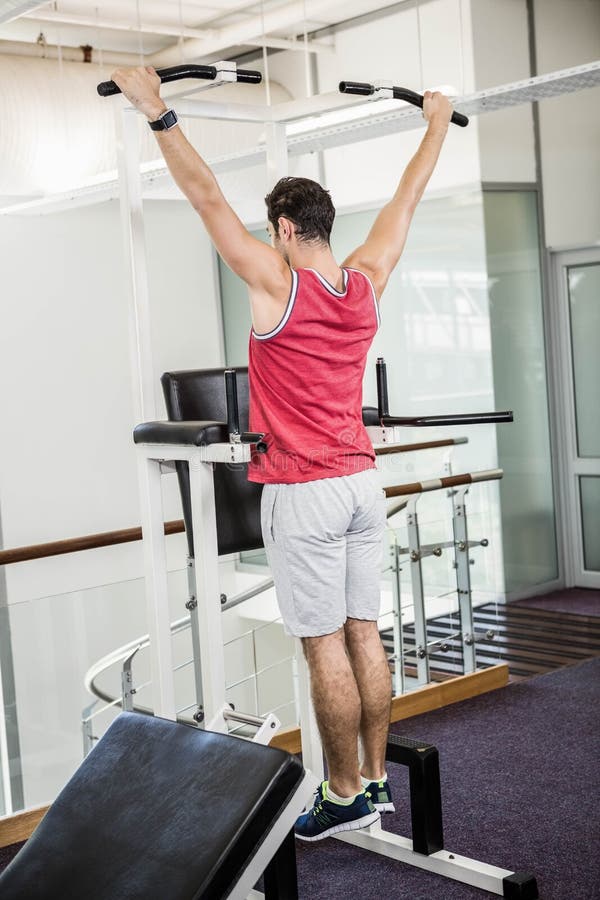 Muscular man doing pull up stock image. Image of person - 66431545