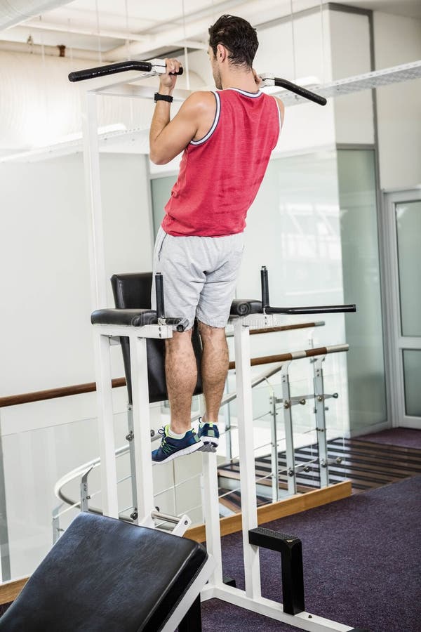 Muscular man doing pull up stock image. Image of person - 66431547