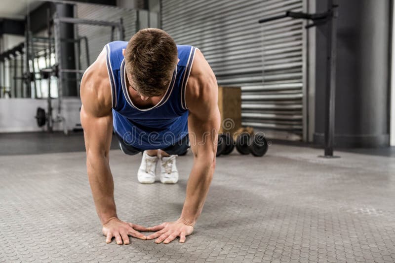 Muscular man doing push up stock photo. Image of leisure - 66930170