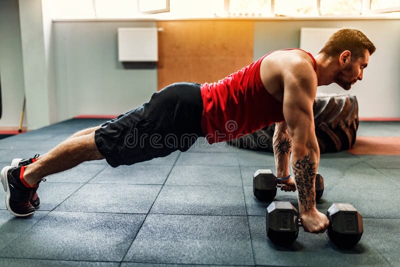 Muscular Man Doing Pushup Exercise with Dumbbell Stock Image - Image of ...