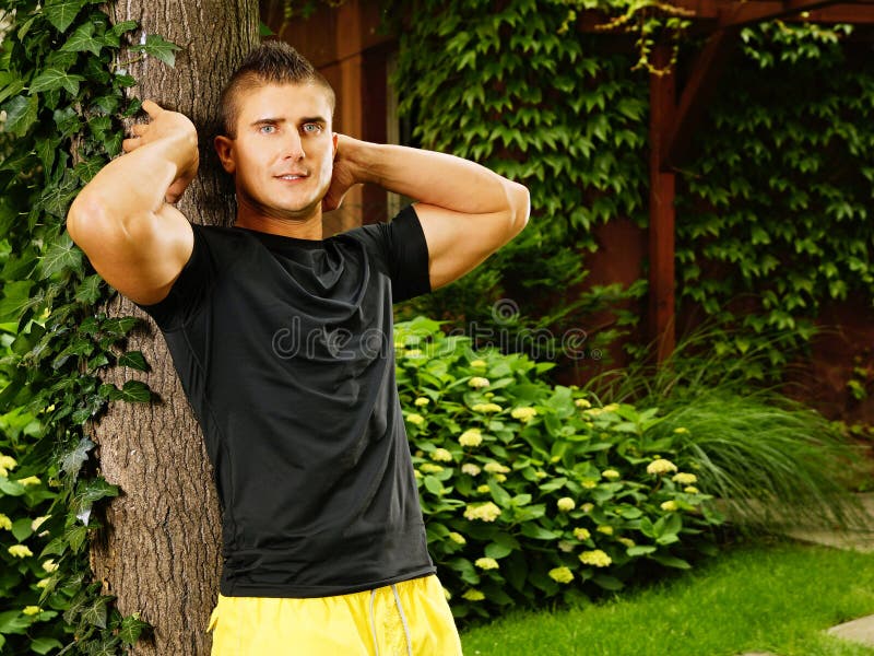 Man Doing Stretching Exercise Against Tree Stock Photos - Free ...