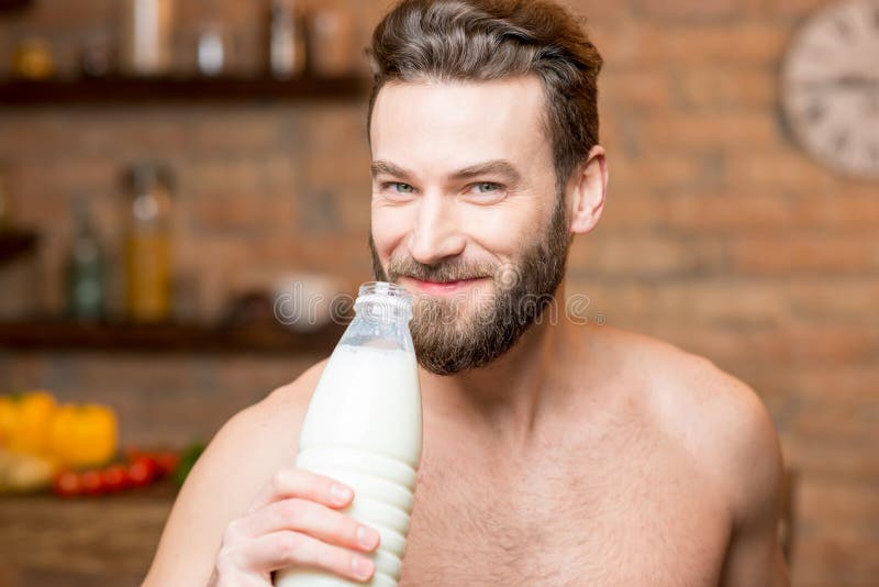 Muscular man drinking milk stock image. Image of bottle - 85043493