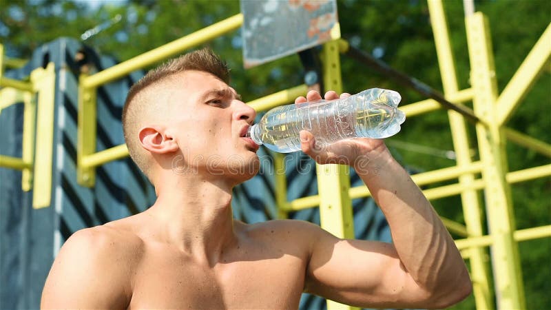 Fit Muscular Man Drinking Water or Energy Drink Stock Footage - Video ...