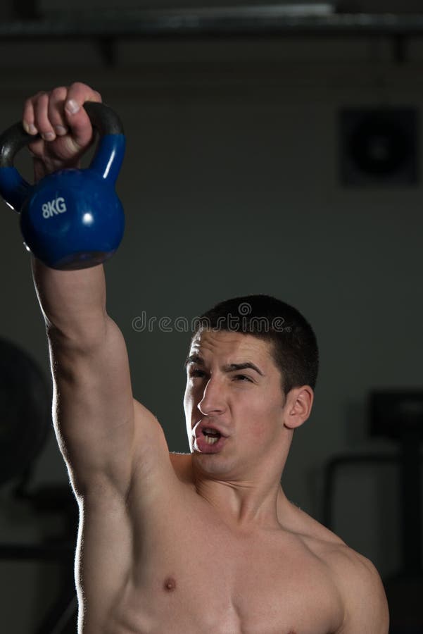 Muscular Man Exercise with Kettle Bell Stock Photo - Image of sport ...
