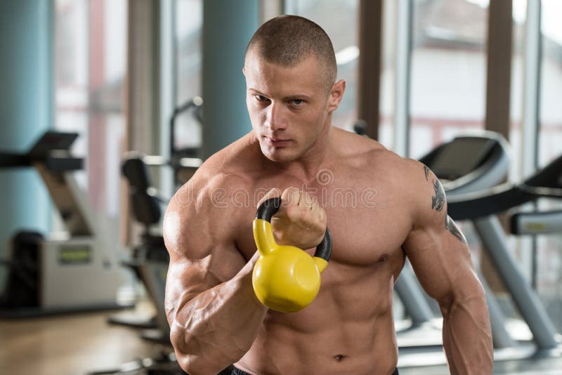 Muscular Man Exercise with Kettle Bell Stock Image - Image of exercises ...