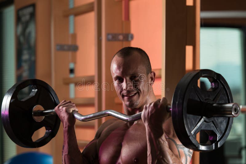 Muscular Man Exercising Biceps Stock Image - Image of muscle, muscular ...