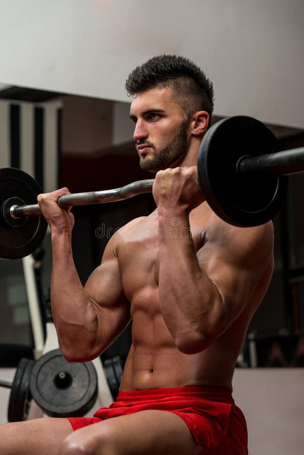 Muscular Man Exercising Biceps Stock Photo - Image of people ...
