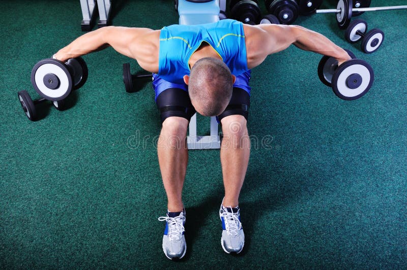 Muscular Man Exercising in a Gym Stock Image - Image of caucasian ...