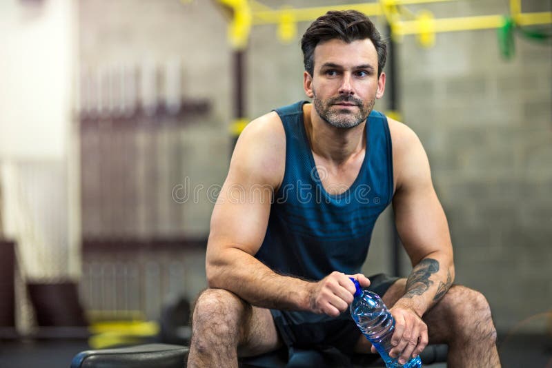 Man working out in gym stock image. Image of biceps - 111939147