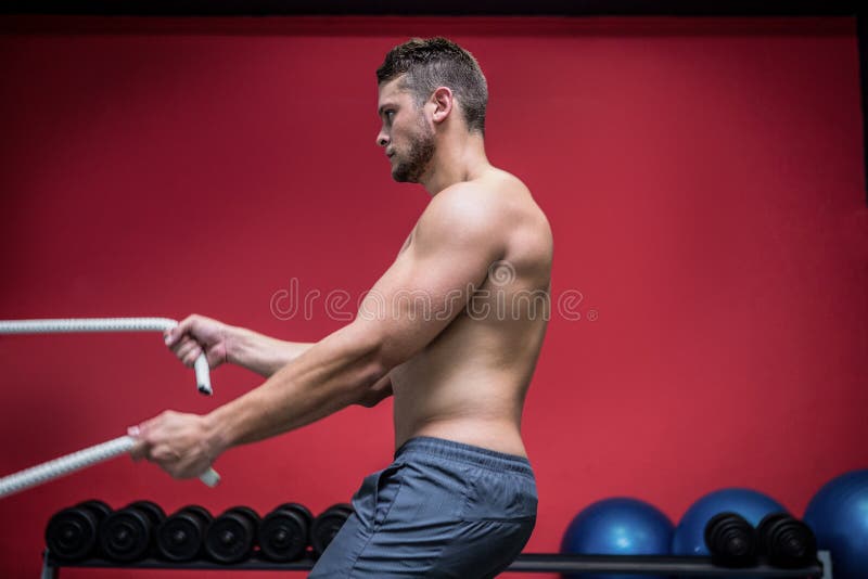 Muscular Man Exercising with Rope Stock Image - Image of adult ...
