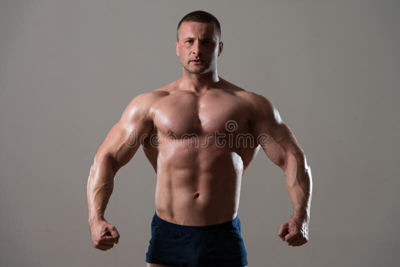 Muscular Man Flexing Muscles Stock Photo - Image of chest, lifestyles ...