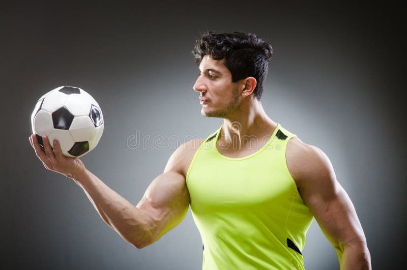 The Muscular Man with Football Ball Stock Photo - Image of leaping ...