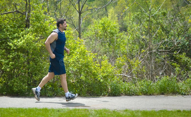 Muscular man jogging stock photo. Image of running, sport - 14472452