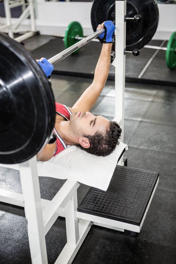 Muscular Man Lifting Barbell on Bench Stock Image - Image of lifting ...