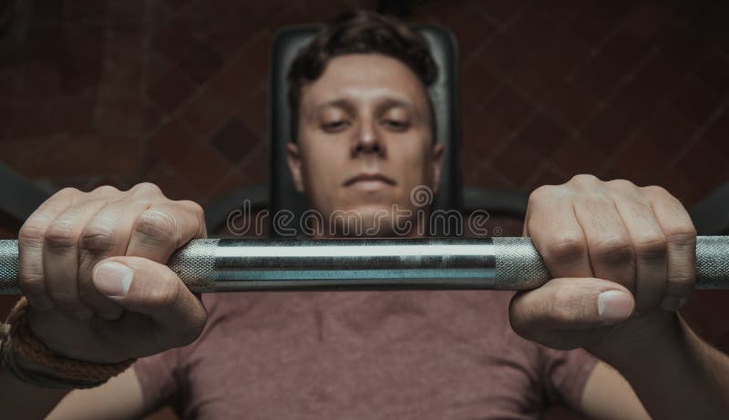 Muscular Man Lifting a Barbell Stock Image - Image of sport, healthy ...