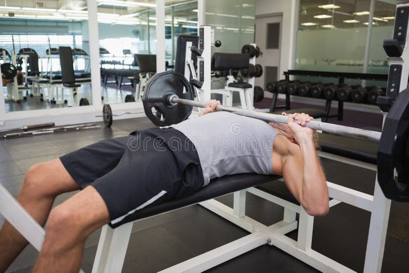 Muscular Man Lifting Barbell In Gym Stock Image Image Of Athletic