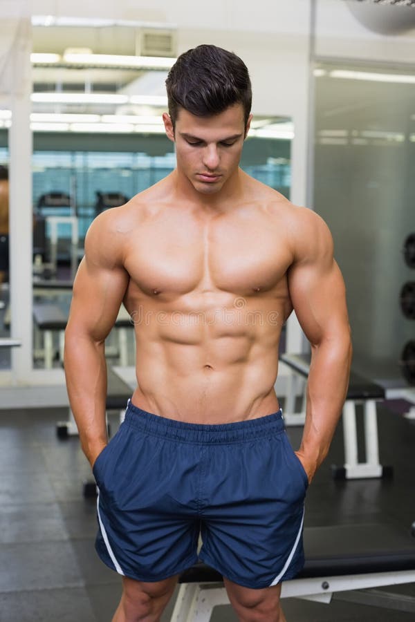 Muscular man looking down stock photo. Image of toned - 42577386