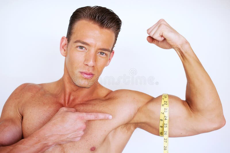Muscular Man Measuring Bicep Stock Photo - Image of built, muscle: 23863186