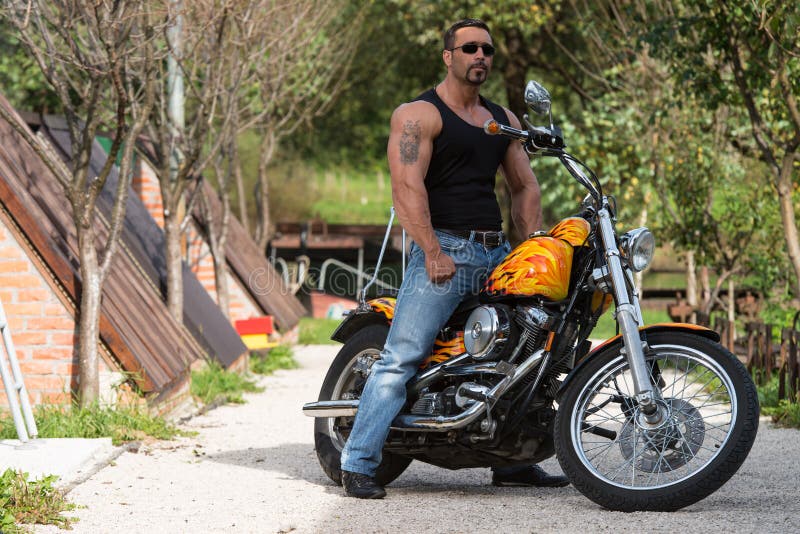 Muscular Man and Motorcycle. Stock Photo - Image of back, hair: 4764686