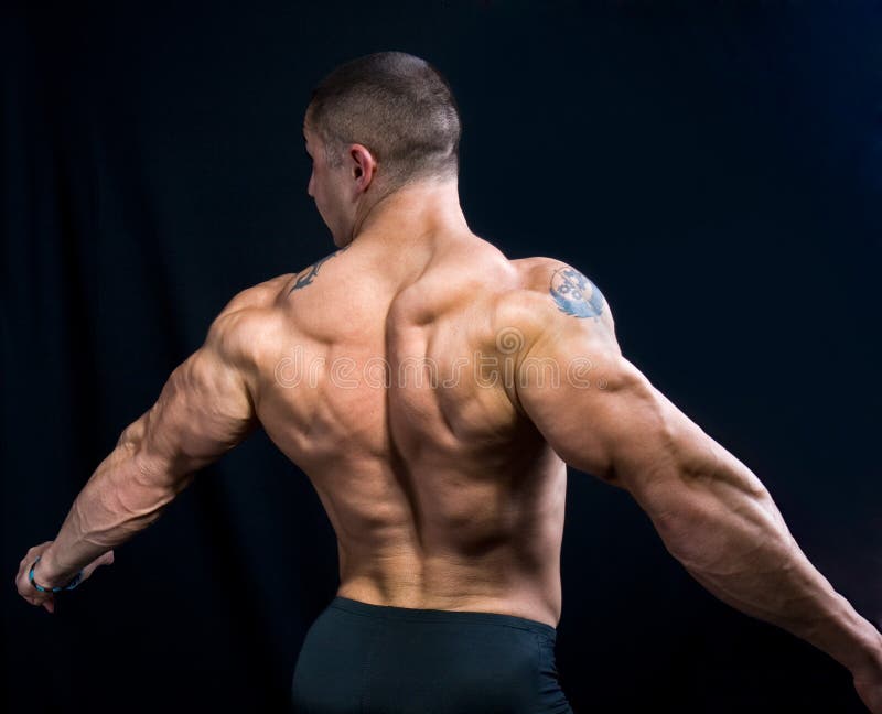 A Muscular Man Posing Artistic, Back Double Biceps Stock Photo - Image of attractive, nipple ...