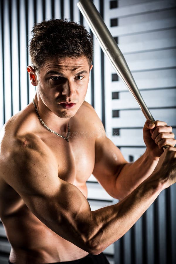 Muscular Man Posing With A Bat Stock Image - Image of bodybuilder ...